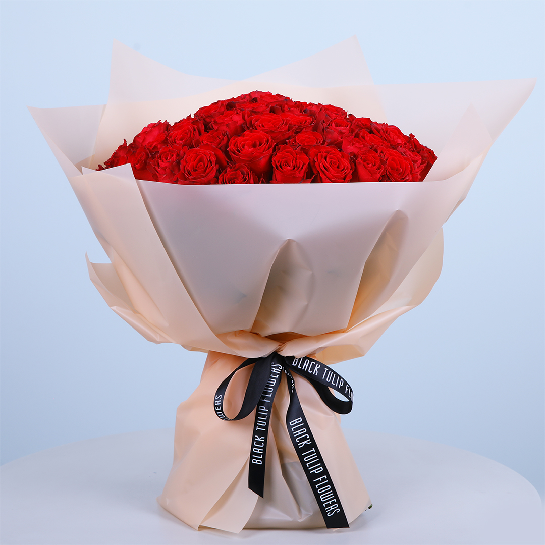 77 Red Roses in peach wrap | Red Rose Bouquet